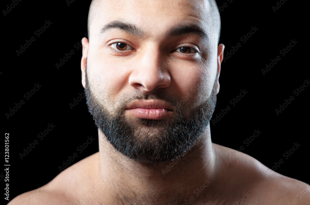 Power and confidence. Close up portrait of strong latino man with beard ...