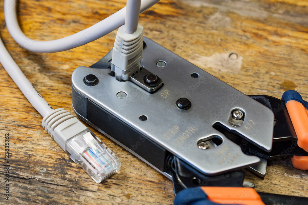 Crimping tool for mounting of the connectors RJ45 on the desktop in a ...