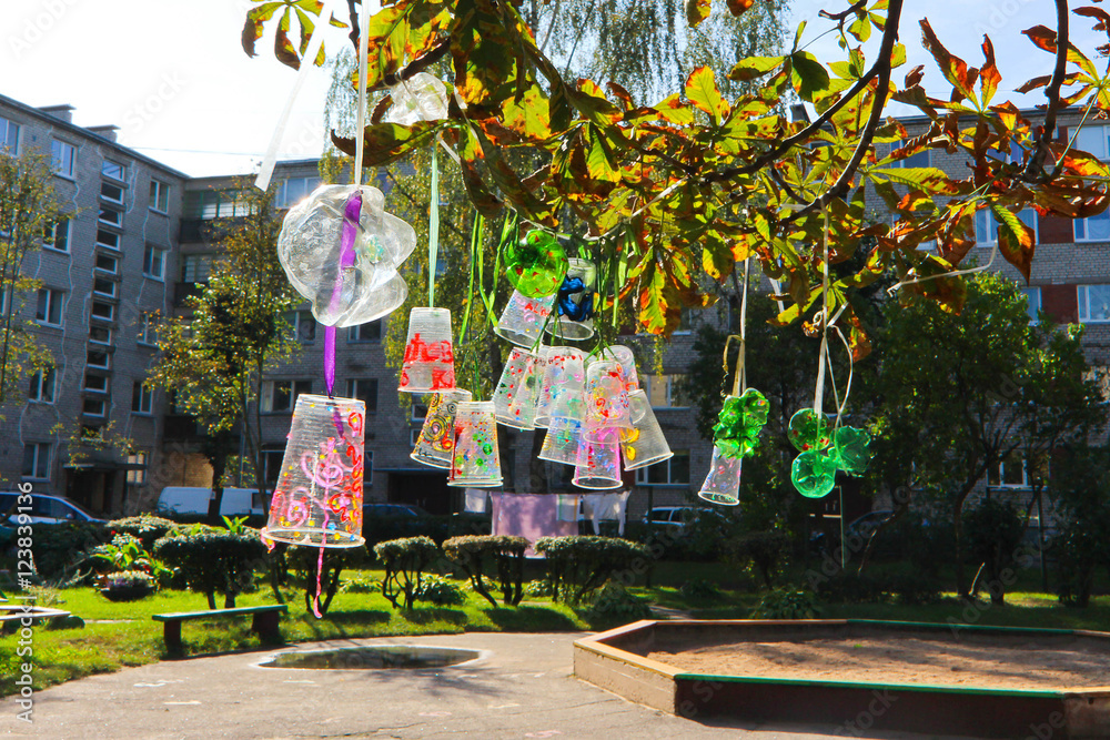 Recycle project of plastic bottles and cups, colored with different ...