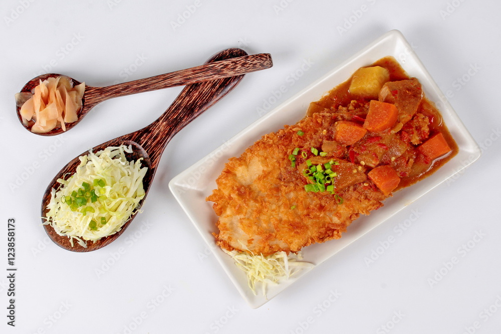 Japanese style of deep fried dolly fish topped yellow curry with sliced ...