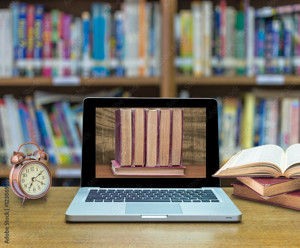 Laptop computer shown the old books in the screen with old books Stock ...