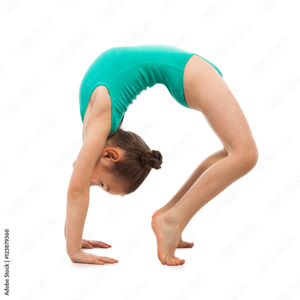 Flexible little girl gymnast doing a bridge on white background Stock ...