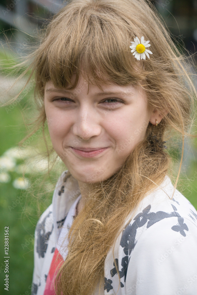 portrait of funny pretty teenage young girl smiling smirk with daisy ...
