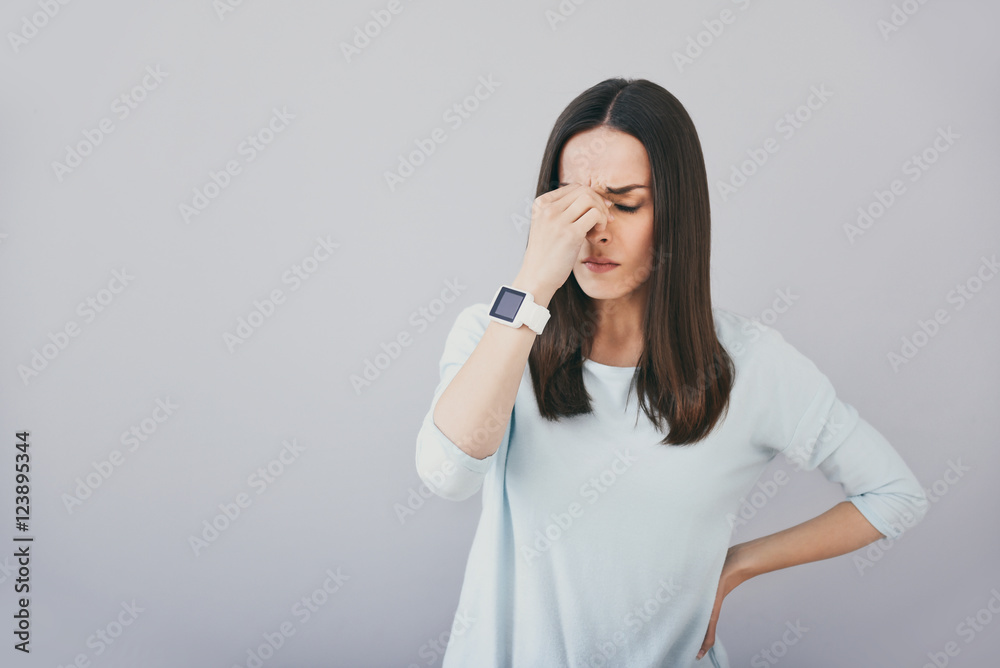 Young sad woman standing against white background. Stock Photo | Adobe ...