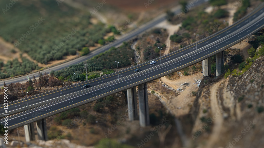 Beautiful view of highway bridge in the country side with passing cars ...