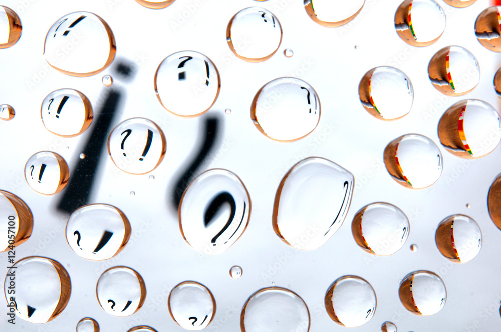 Question mark and exclamation mark behind water drops. Abstract ...
