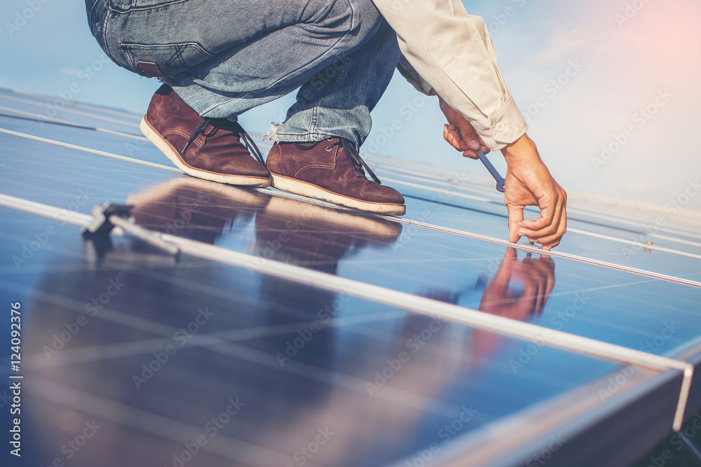 engineer working on maintenance equipment at green energy solar power ...