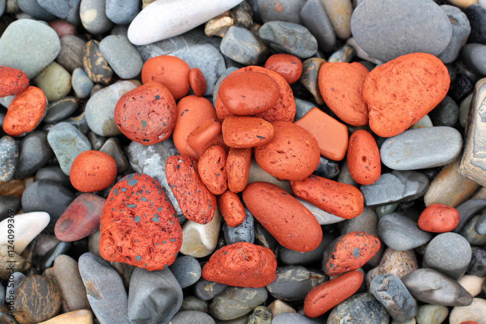 red stones on a pebble beach background Stock Photo | Adobe Stock