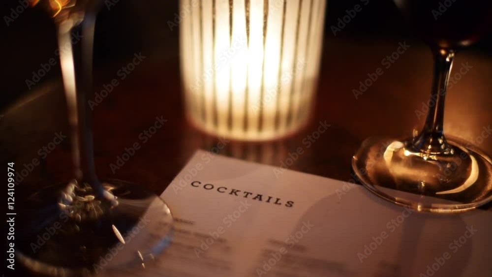 Cocktail menu with glasses, romantic candle light, close up Stock Video ...