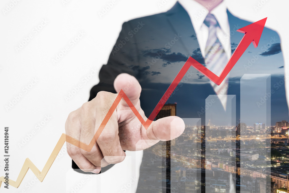 Businessman drawing a rising up arrow by finger, representing business ...