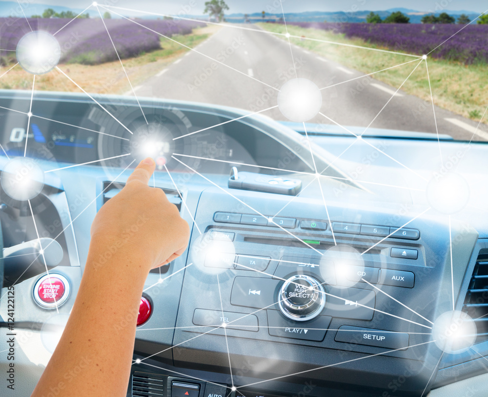 Self-driving car concept - someones hand programming modern car Stock ...
