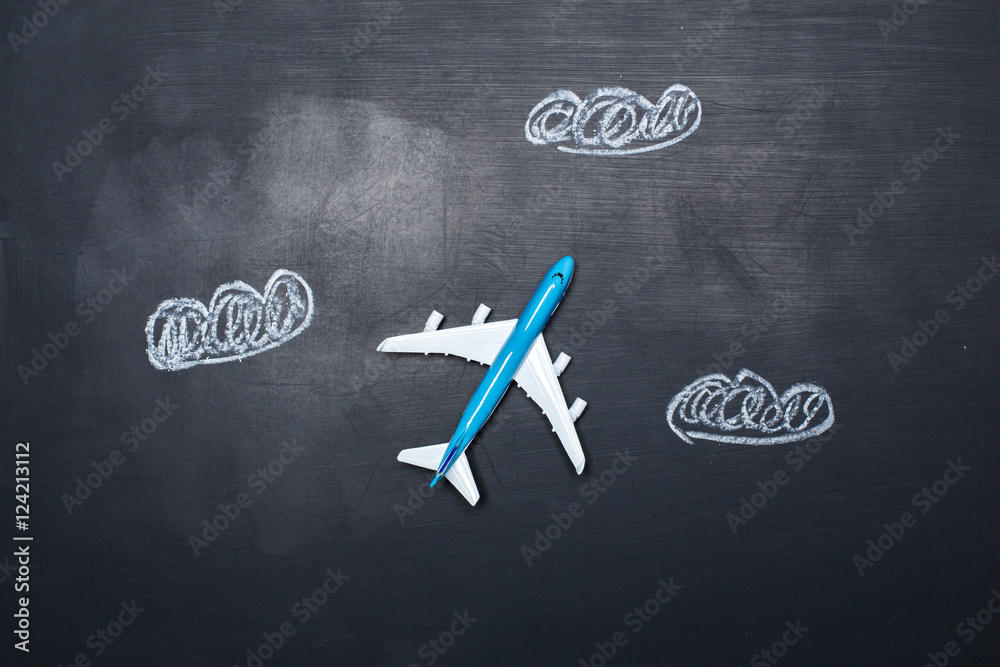 toy airplane over chalkboard background and arrows drawings Stock Photo ...