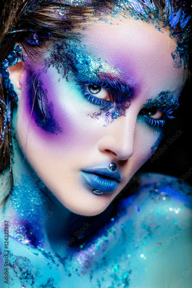 Portrait of a beautiful mermaid girl. Wet skin, wet hair, glitter and ...