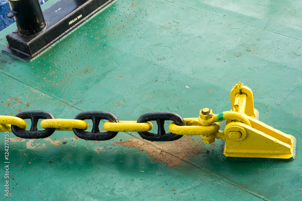 Anchor chain secured to stopper or pad-eye on construction barge Stock ...