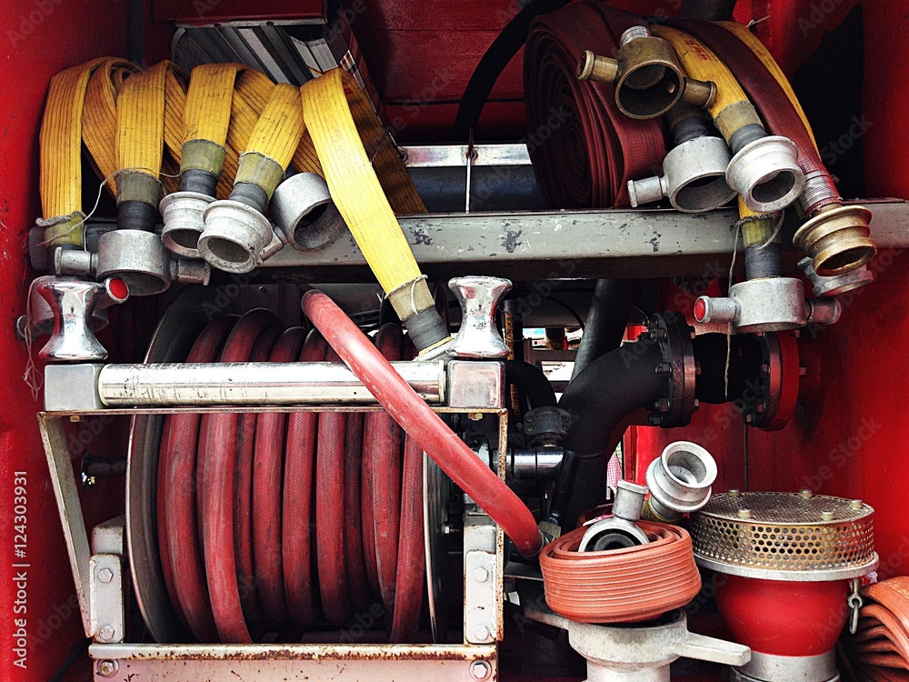 Foto de Fire hose and other equipment in a truck, fire water hose ...