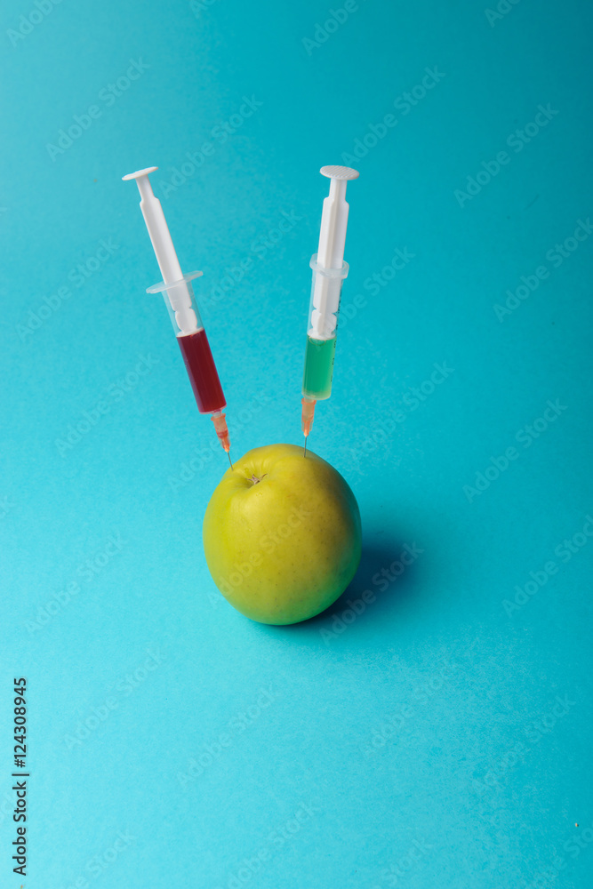 Chemical additives in food or genetically modified fruit concept Stock ...