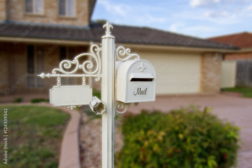 white ornamental Letter box with a facility to write house number and a ...