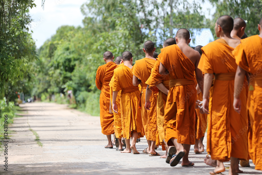 Monks were walking on the road for head to the temple. Stock Photo ...