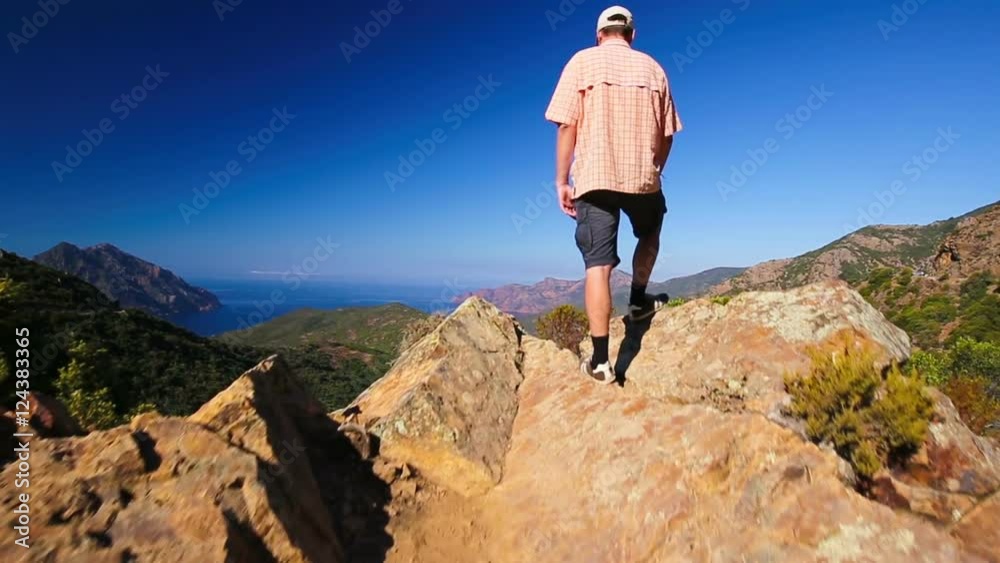 Young attractive man enjoying the view from famous D81 coastal road ...