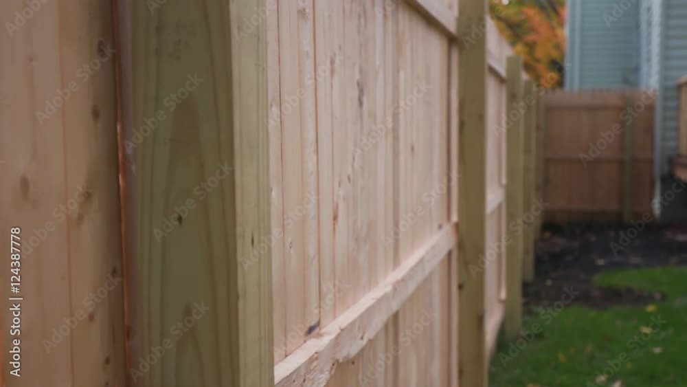 Move Forward and Backward Along Side of New Fence. the shot slowly ...