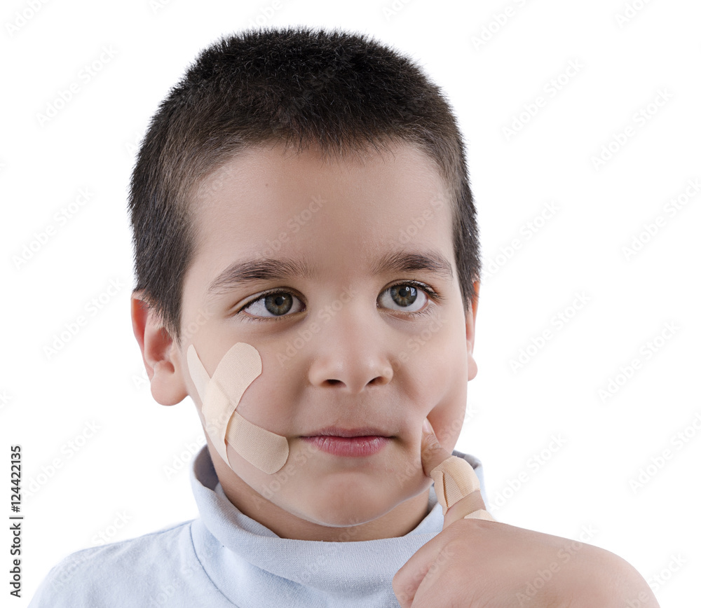 Band aid applied to cute boy's cheek isolated on white background ...