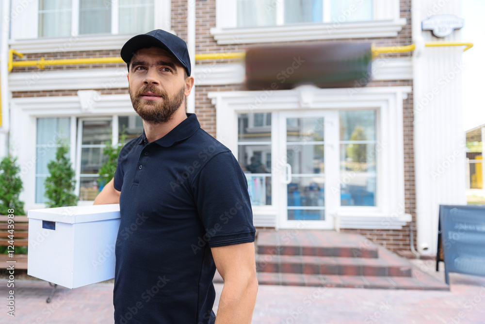 bearded postman standing outdoors Stock Photo | Adobe Stock