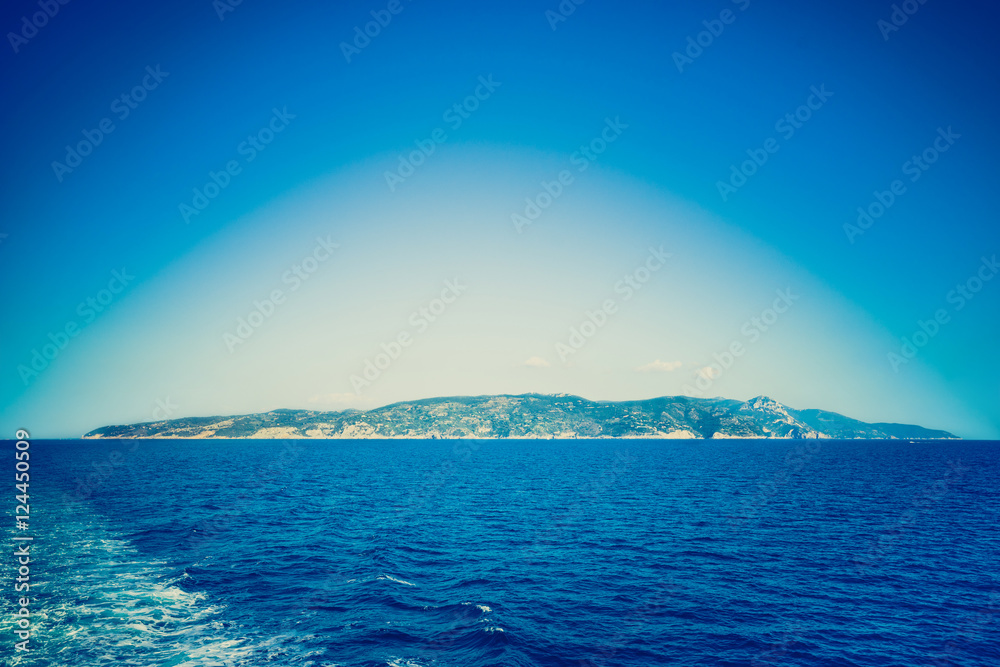 Deep blue filtered vignetted panorama view of Argentario peninsula on ...