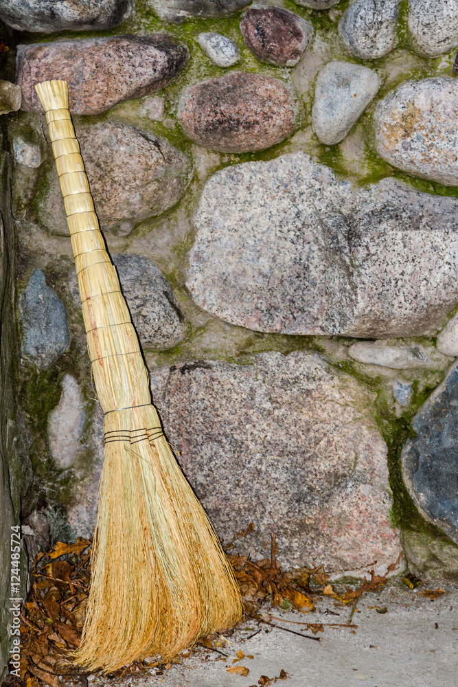broom against the wall Stock Photo | Adobe Stock