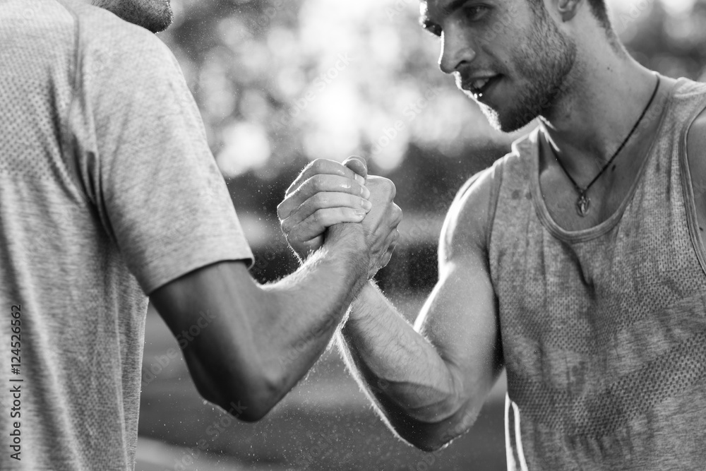 Black-and-white photograph of arms with muscles handshake Stock Photo ...