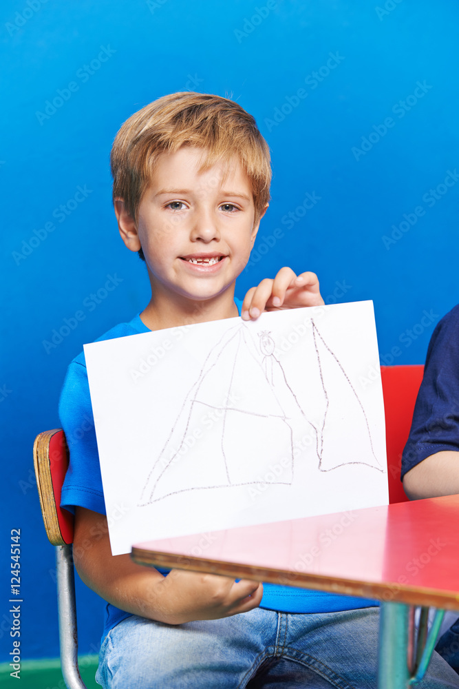 Boy showing drawing in kindergarten Stock Photo | Adobe Stock