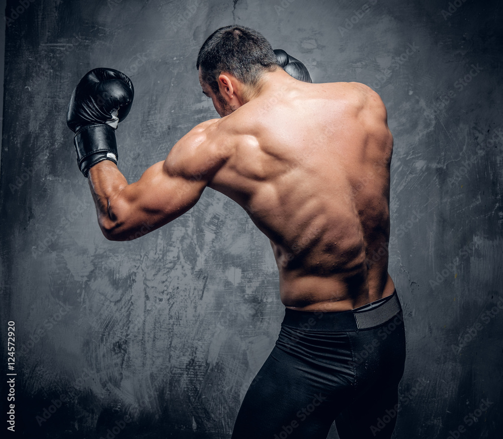 Shirtless muscular fighter from the back. Stock Photo | Adobe Stock