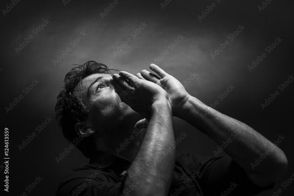 Despairing man screaming. Low key black and white portrait. Help ...
