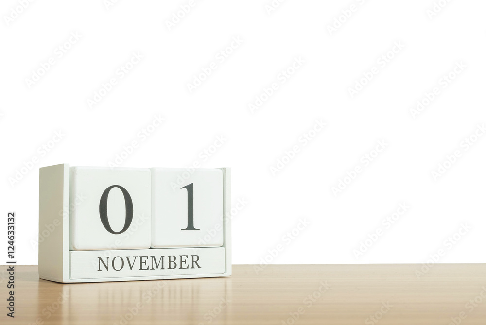Closeup surface white wooden calendar with black 1 november word on ...