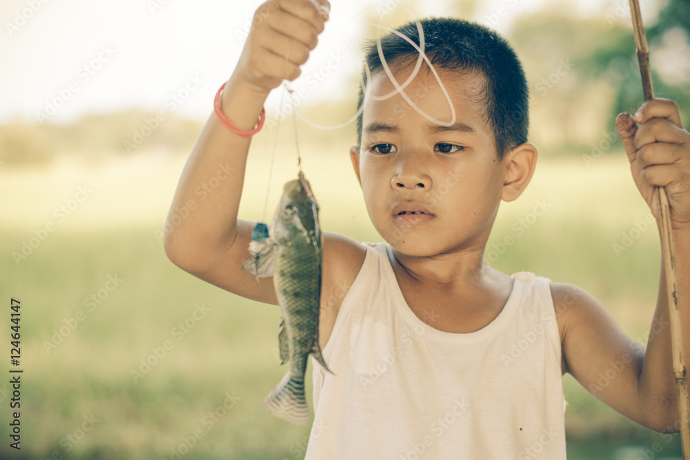 Boy Catching Fish