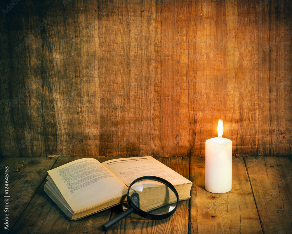 Old Open Book With Candle