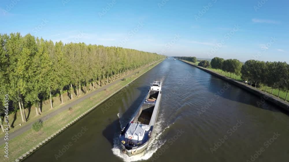 Aerial birds-eye view of an empty barge drone flying backwards near ...