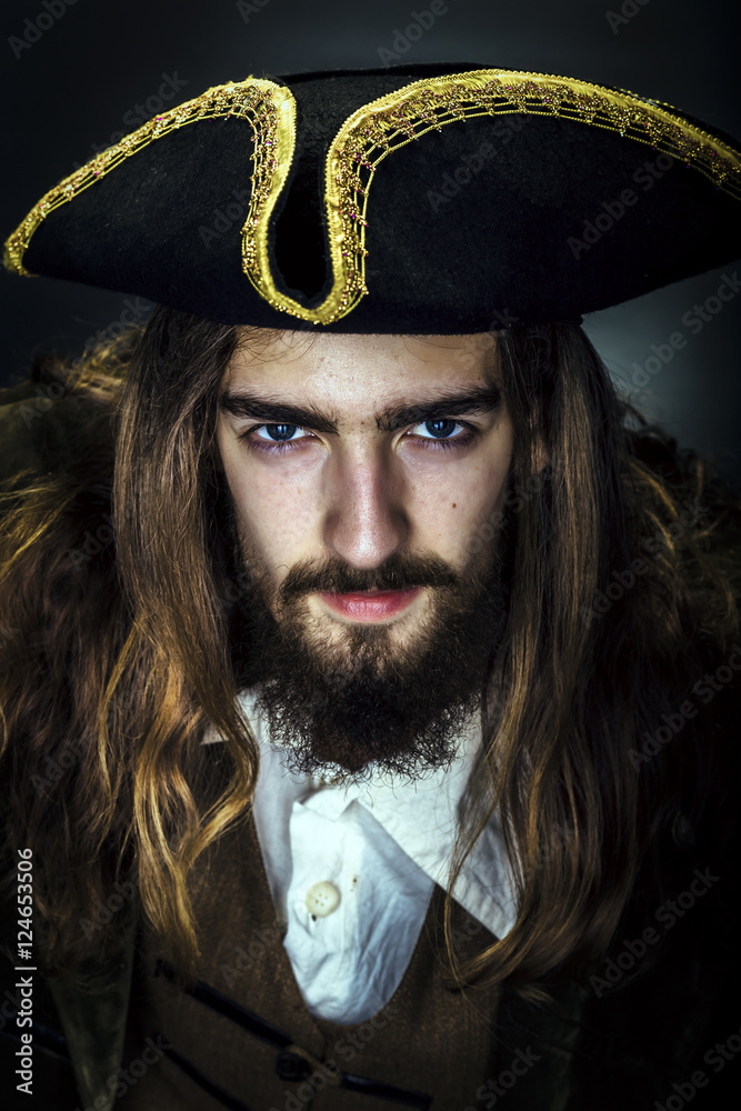 Portrait of a medieval bearded pirate on black background. Stock Photo ...