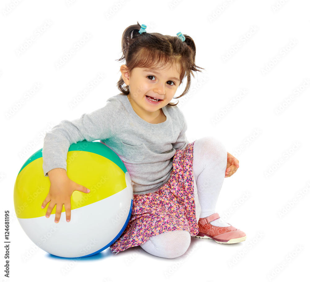 Little girl hugging a big ball Stock Photo | Adobe Stock