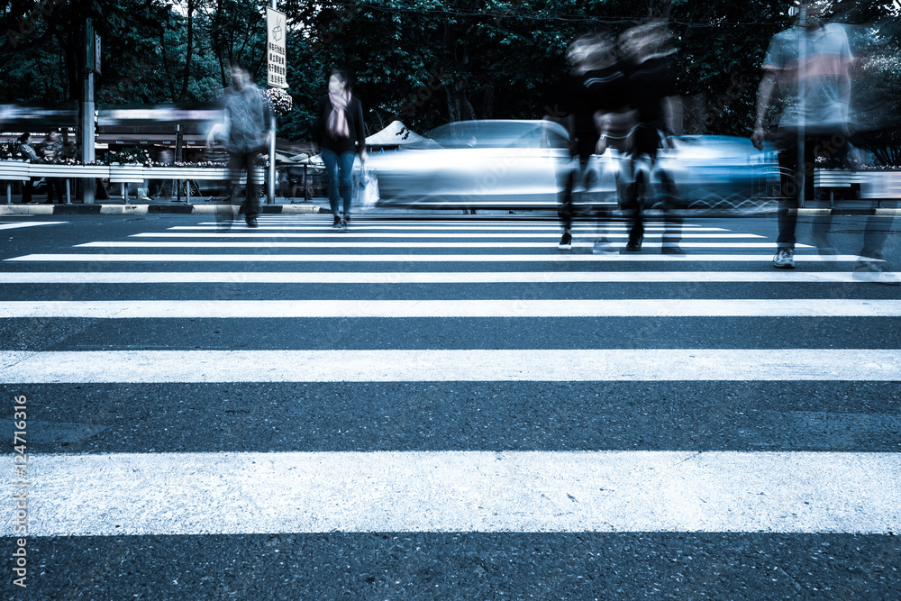 Crosswalk and pedestrian at modern city zebra crossing street. Blur ...