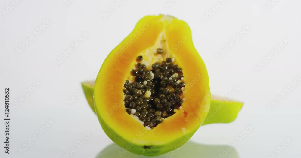 Still life with spinning sliced papaya isolated on white background ...