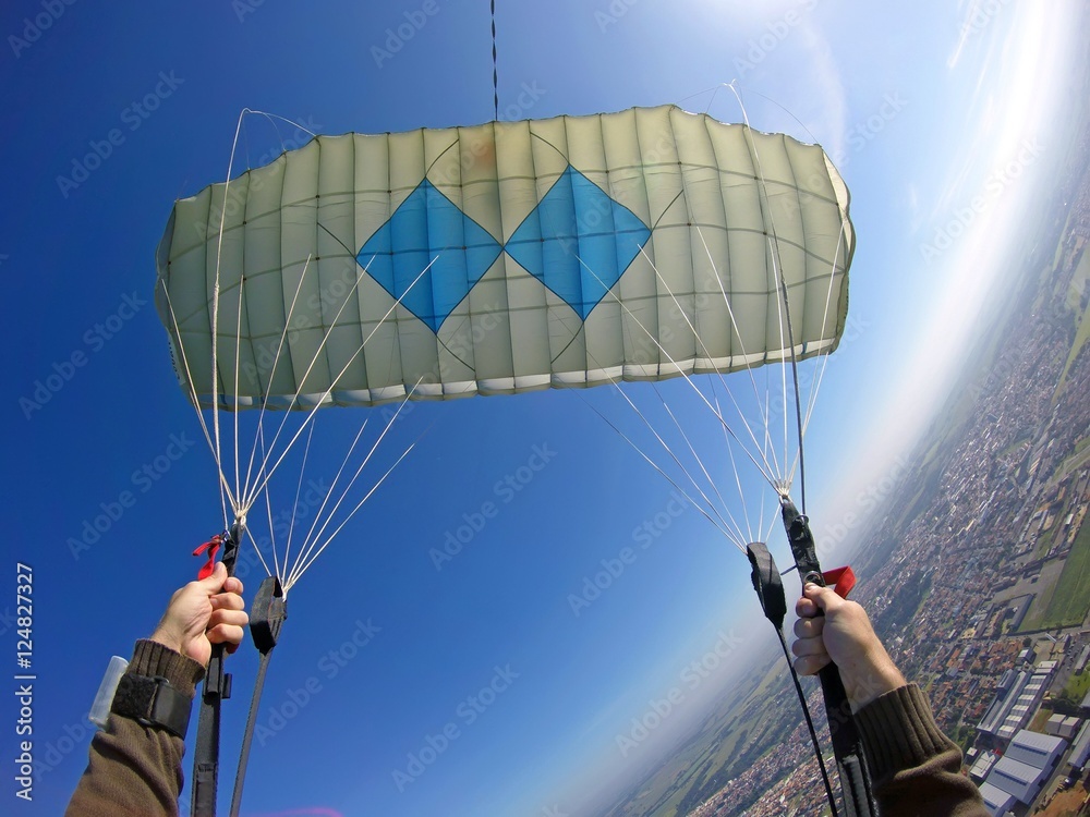 Point of view of skydiver piloting his parachute Stock Photo | Adobe Stock