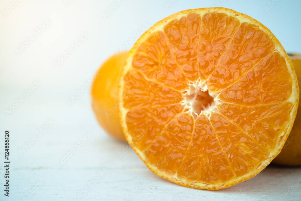 Oranges, close up whole orange fruits and sliced orange on wood Stock ...