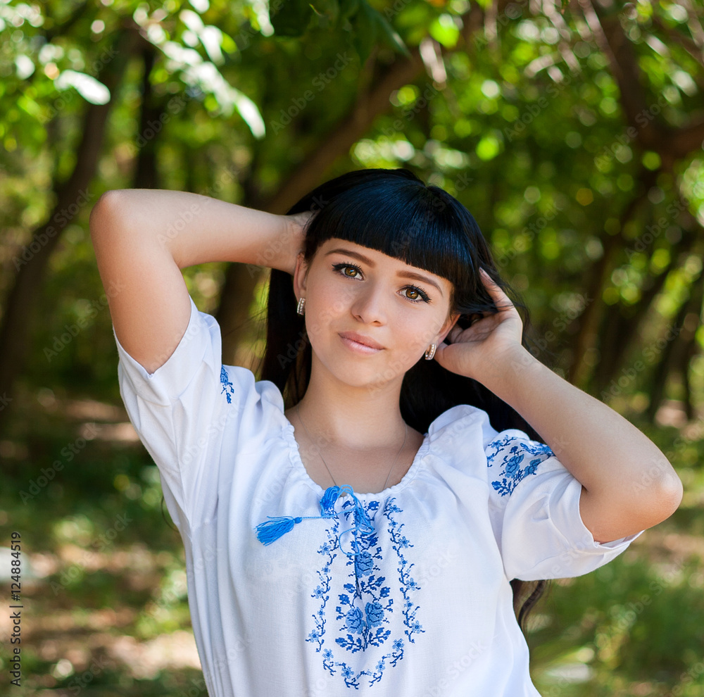 Beautiful young Ukrainian girl in national costume. Girl with beautiful ...