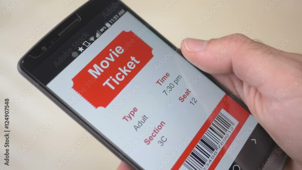 Movie theatre ticket showing on a smartphone screen. Digital eTicket ...