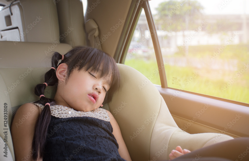 little girl sleeping in child car seat Stock Photo | Adobe Stock