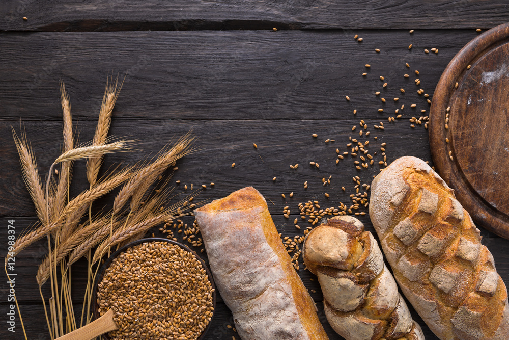 Bread bakery background. Brown and white wheat grain loaves composition ...