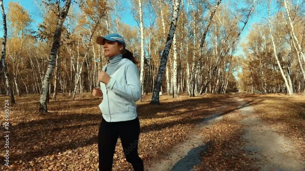 Girl running in the morning forest. Sport Stock Video | Adobe Stock