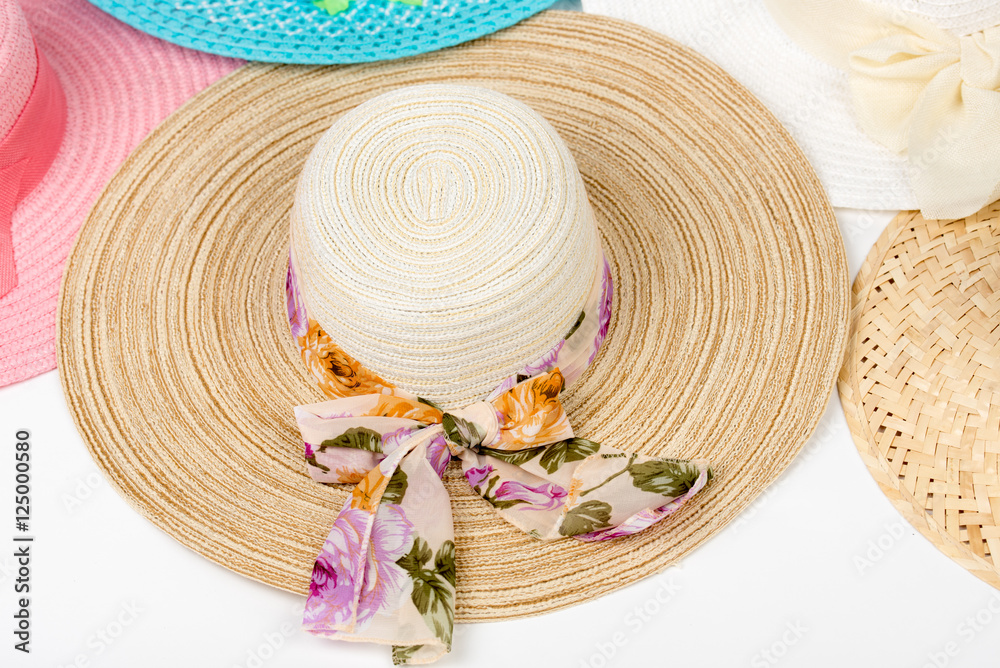 Beautiful summer hats. Colorful hats on white background. Flowery bow ...