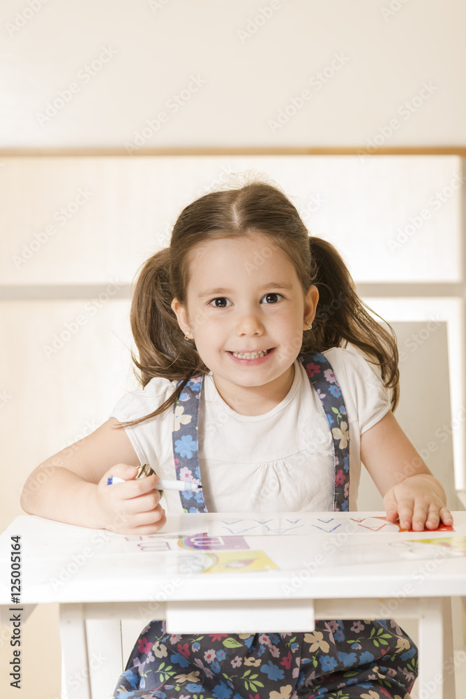 Little child writing letter A. Learning to write. Little girl writing ...