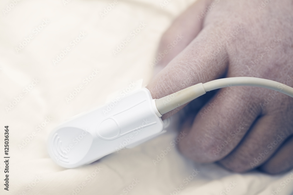 Pulse sensor on the finger of the critical patient Stock Photo | Adobe ...